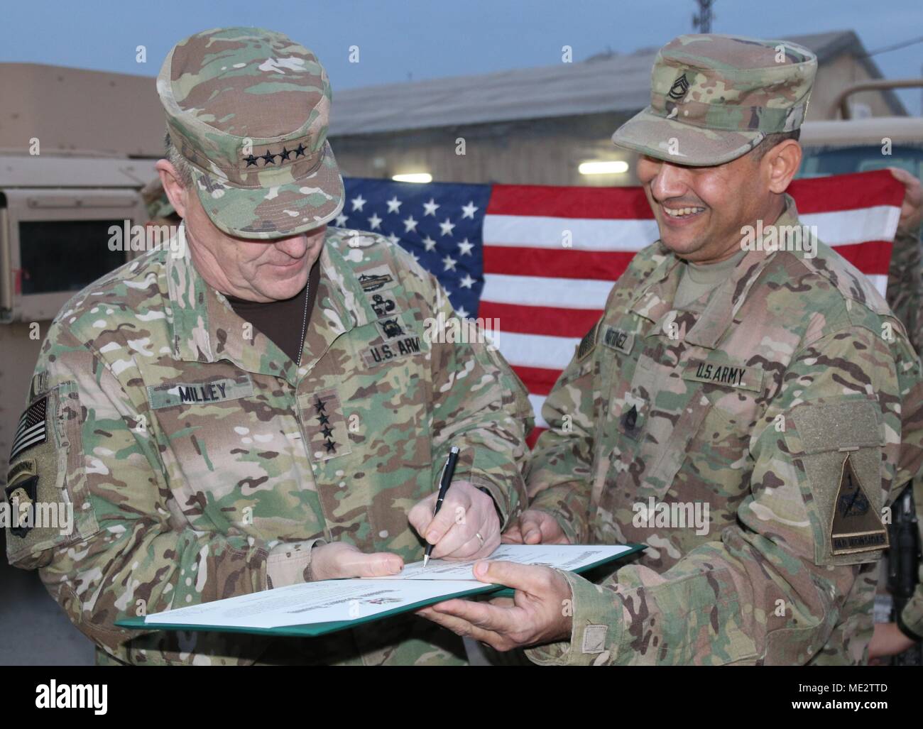 Army Chief of Staff Gen. Mark A. Milley signs an oath of enlistment for ...