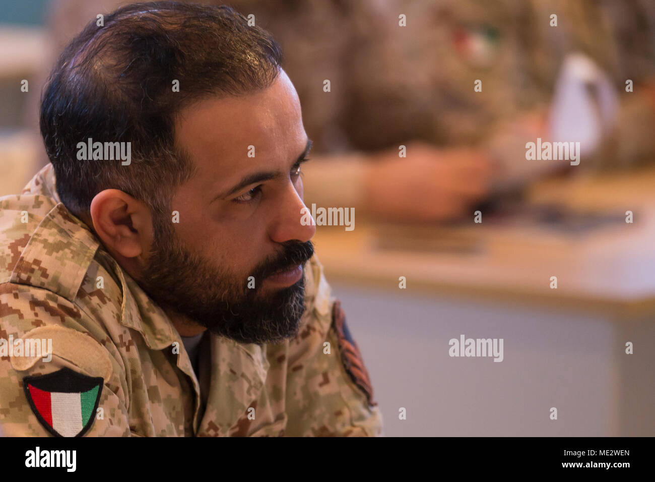 A Kuwaiti Marine, with the Kuwaiti Marine Battalion, listens to Maj ...