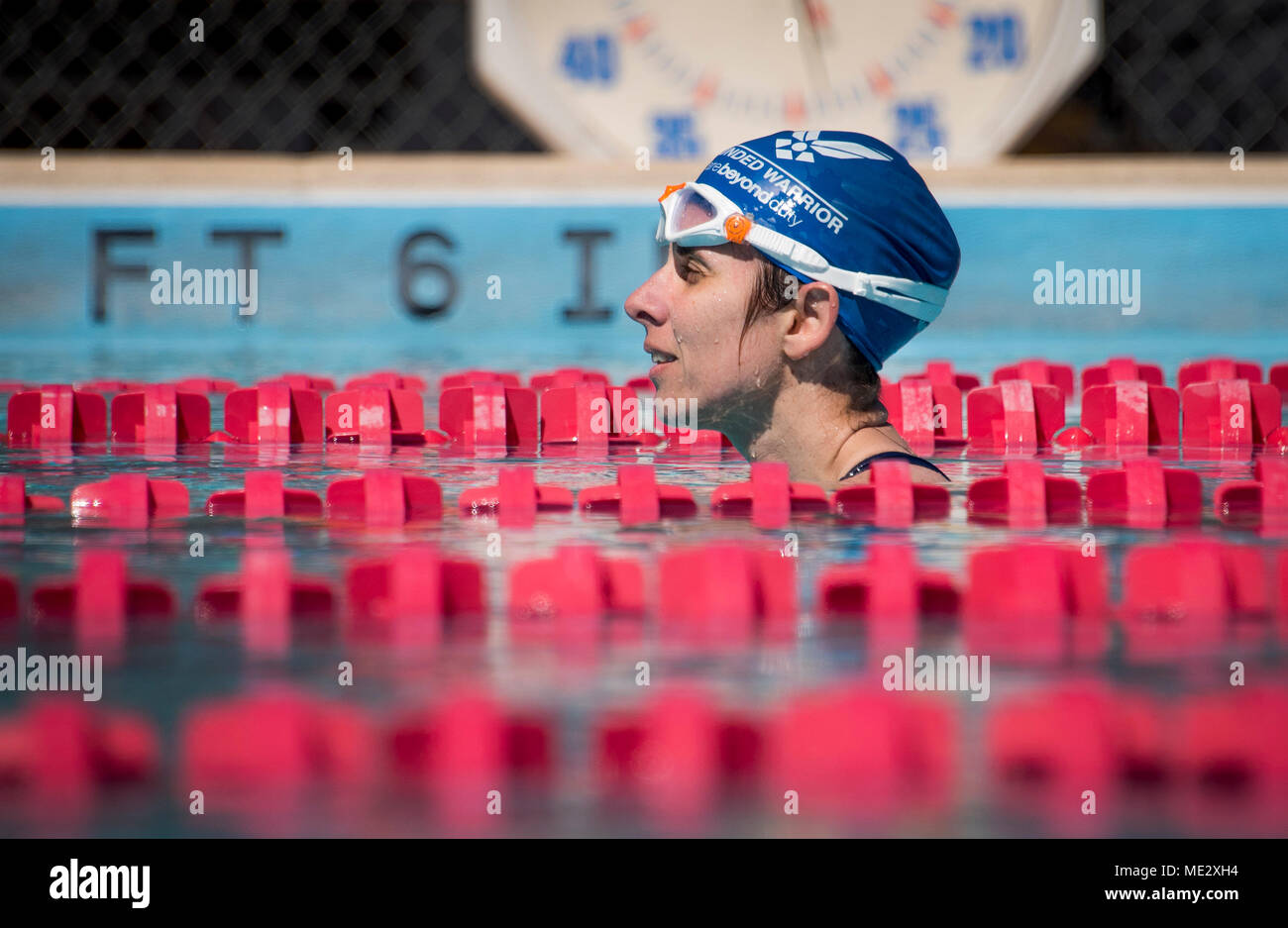 Audra Lyons, A Warrior Games athlete, takes a break during a swim ...
