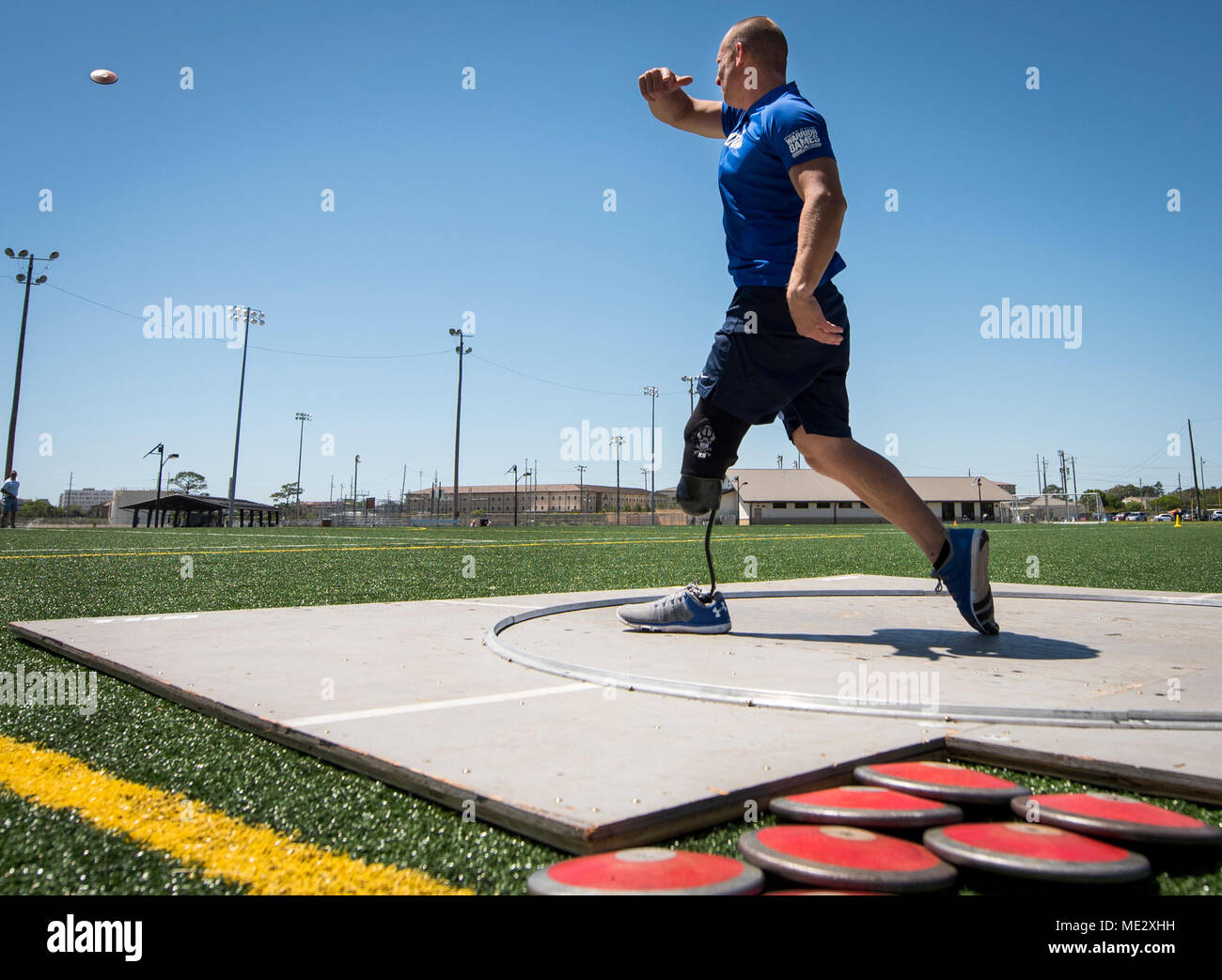 Ben Seekell, a Warrior Games athlete, releases his disc during a track ...