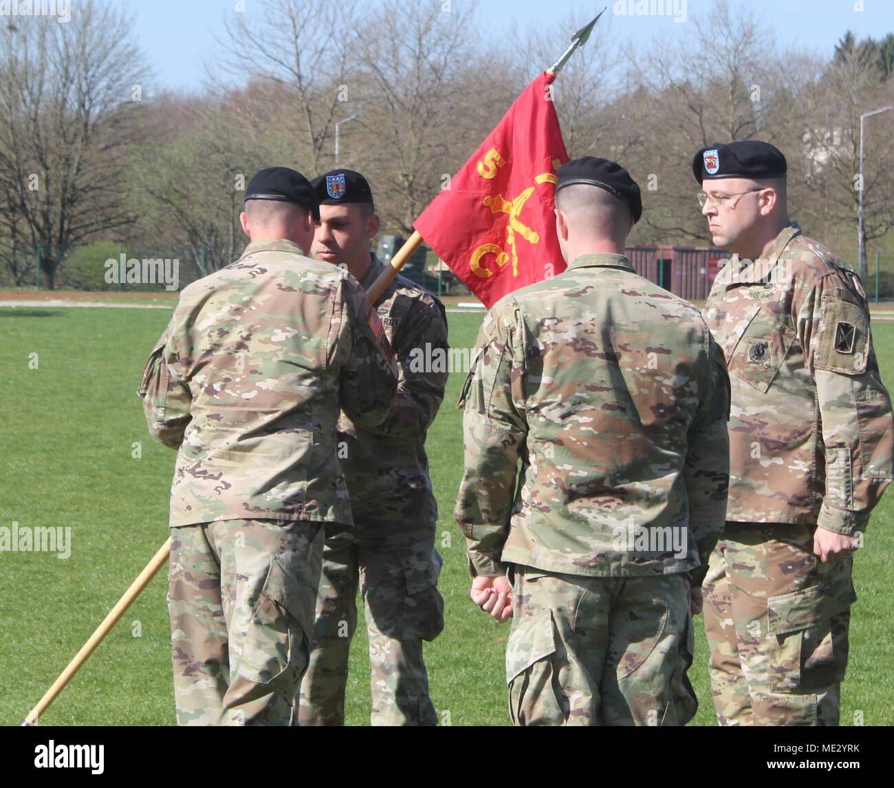 Lt. Col. Barry S. Carter passes the battery guidon to the incoming ...