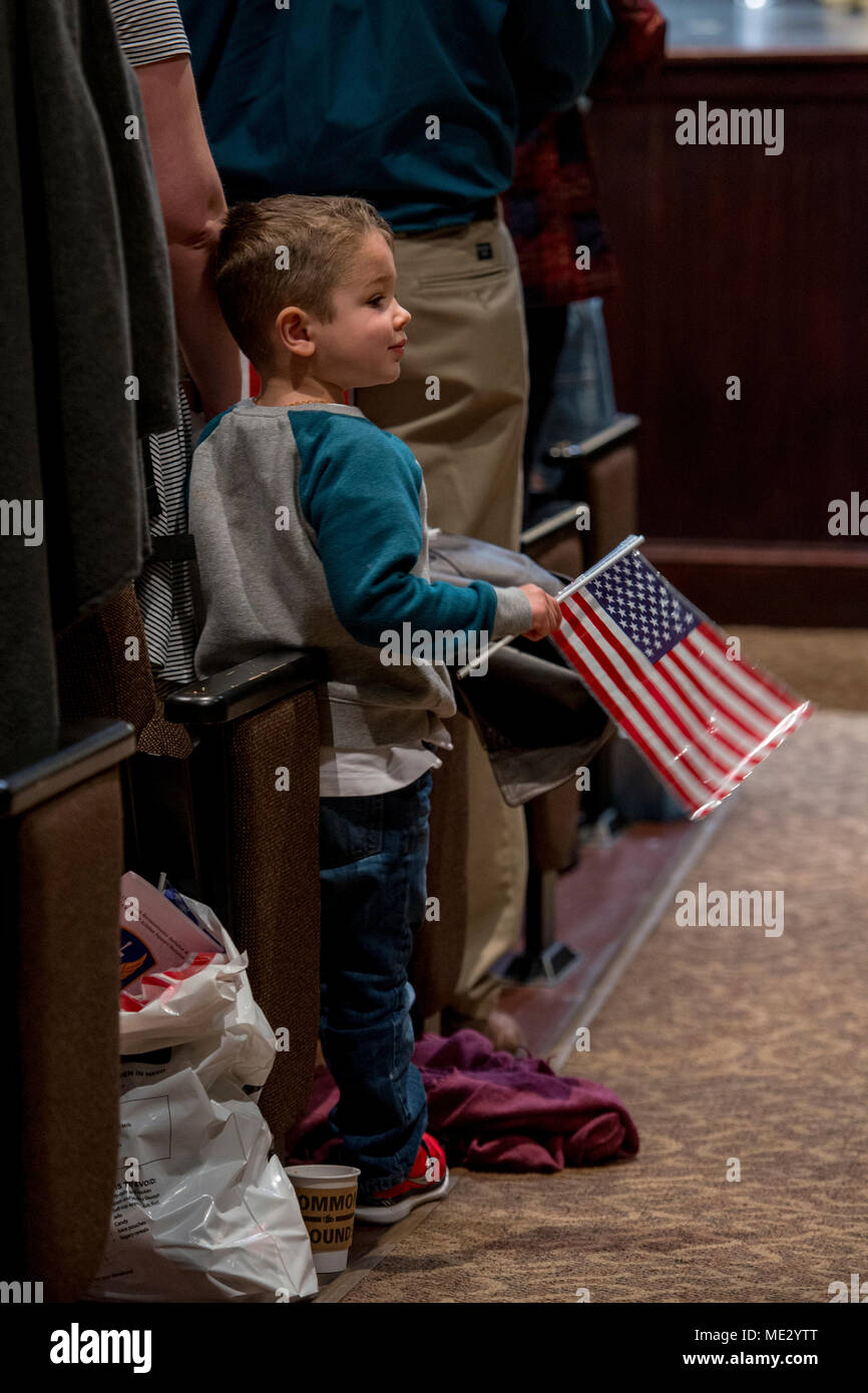 Soldiers fill their seats as family and friends cheer during the ...
