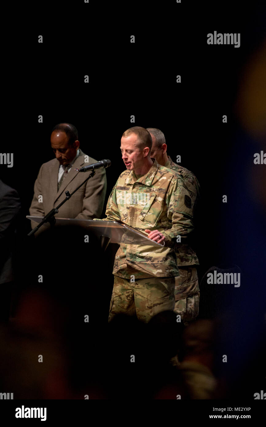 Chaplain 1st Lt. Jacob Henry delivers the invocation during a ...