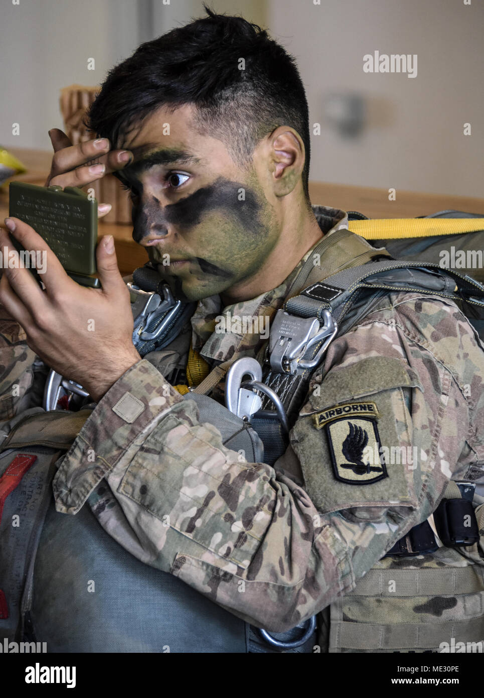 A paratrooper uses various colors to shade the high and love parts of ...