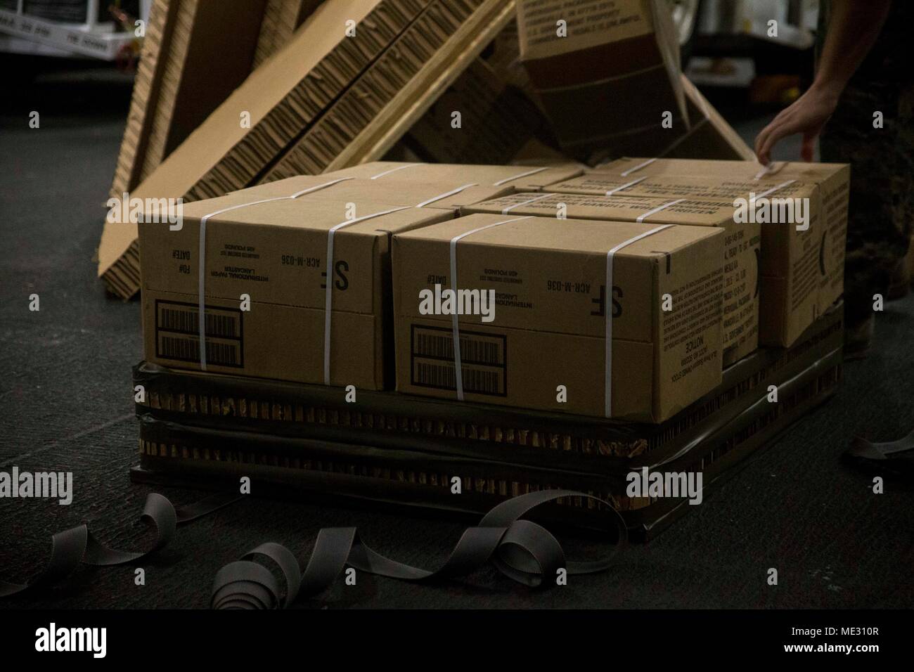 MRE’s are placed on a pallet in preparation for an aerial delivery ...
