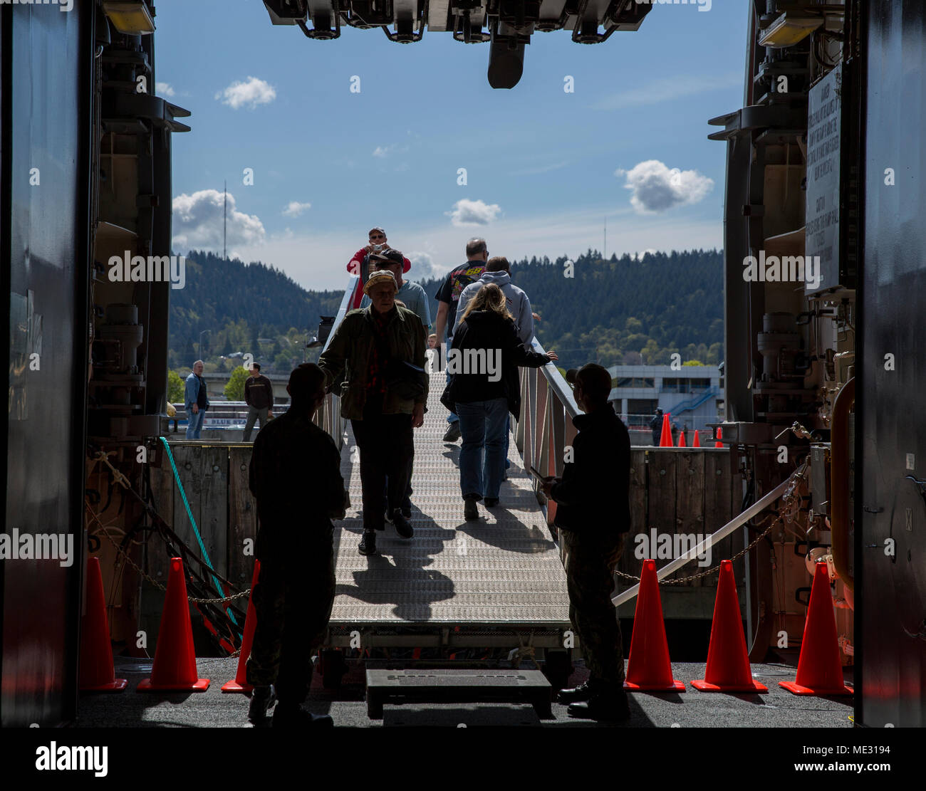 Visitors board the future USS Portland (LPD 27) in Portland, Oregon ...
