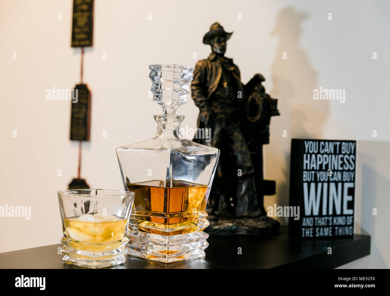 a half full bottle of brandy and a glass brandy on the rock Stock Photo ...