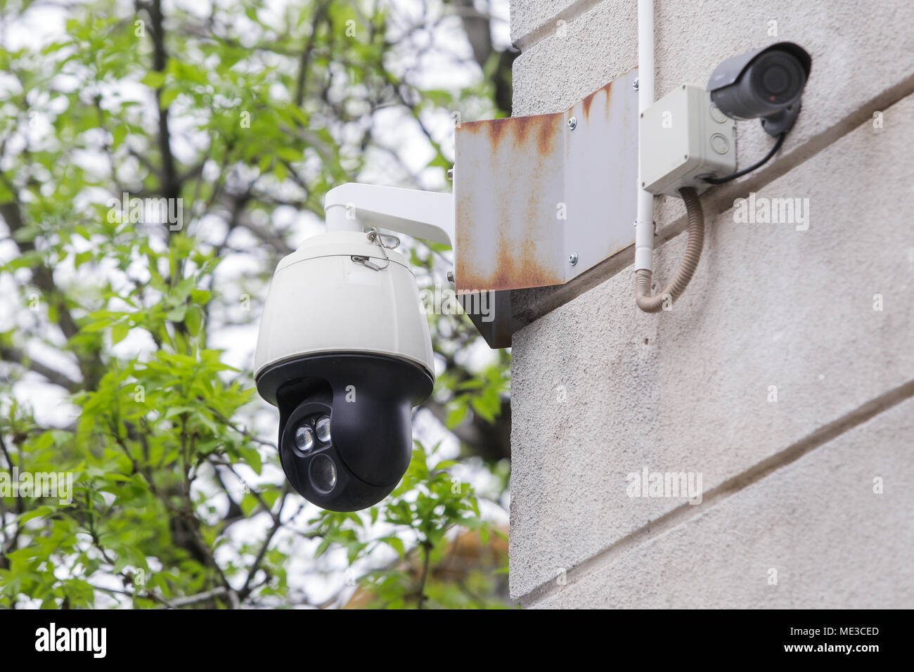 Surveillance cameras on the exterior wall of a building Stock Photo - Alamy