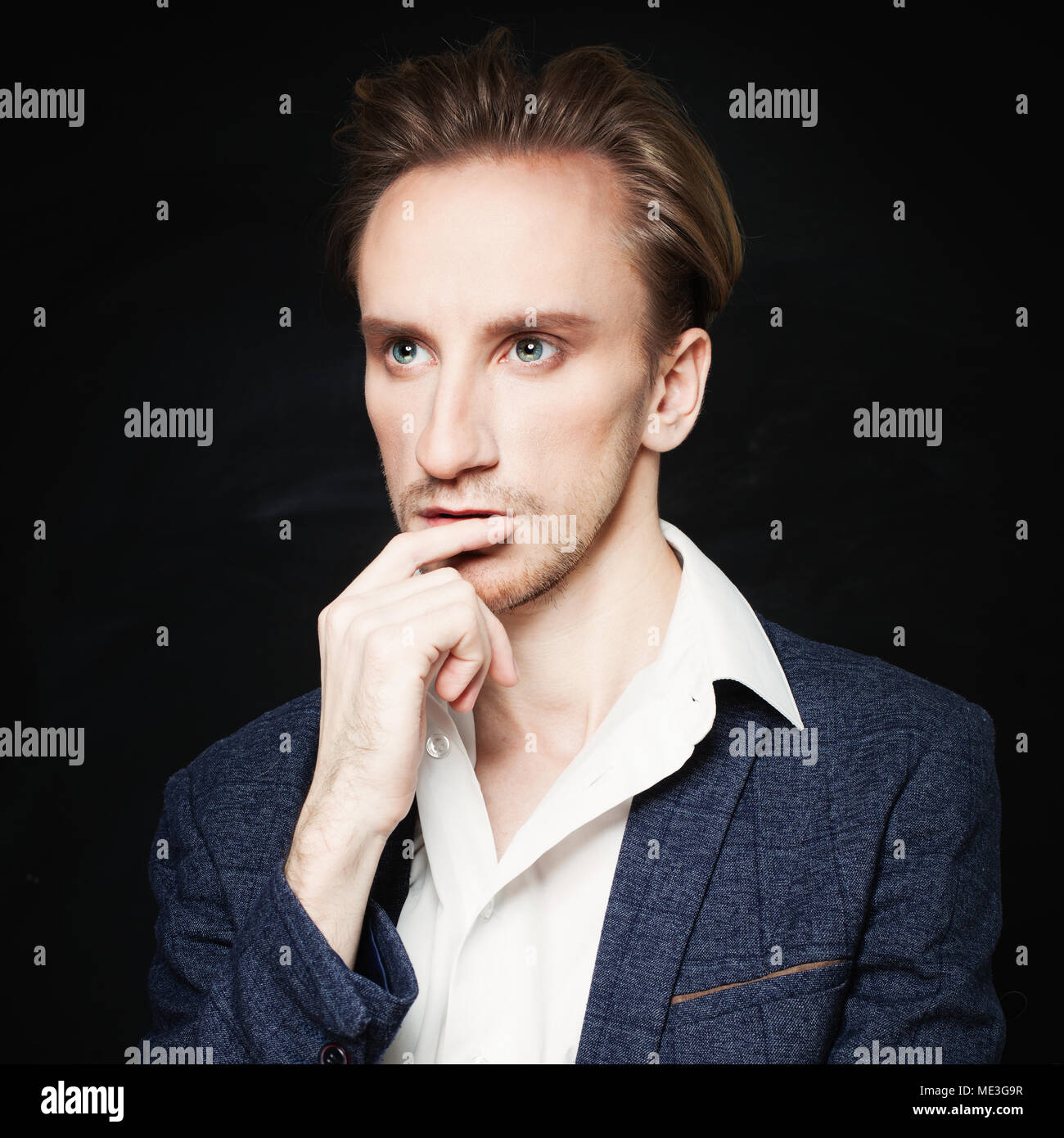 Handsome guy in thinking pose hi-res stock photography and images - Alamy