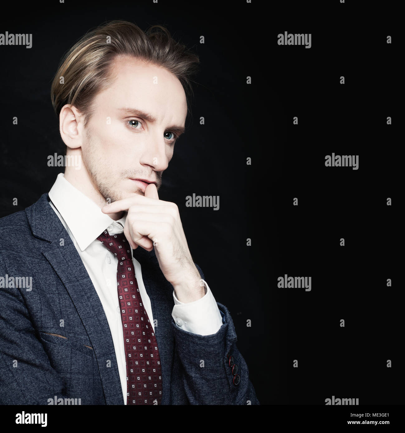 Smart Business Man wearing Suit and Tie on Dark Background with Copy ...
