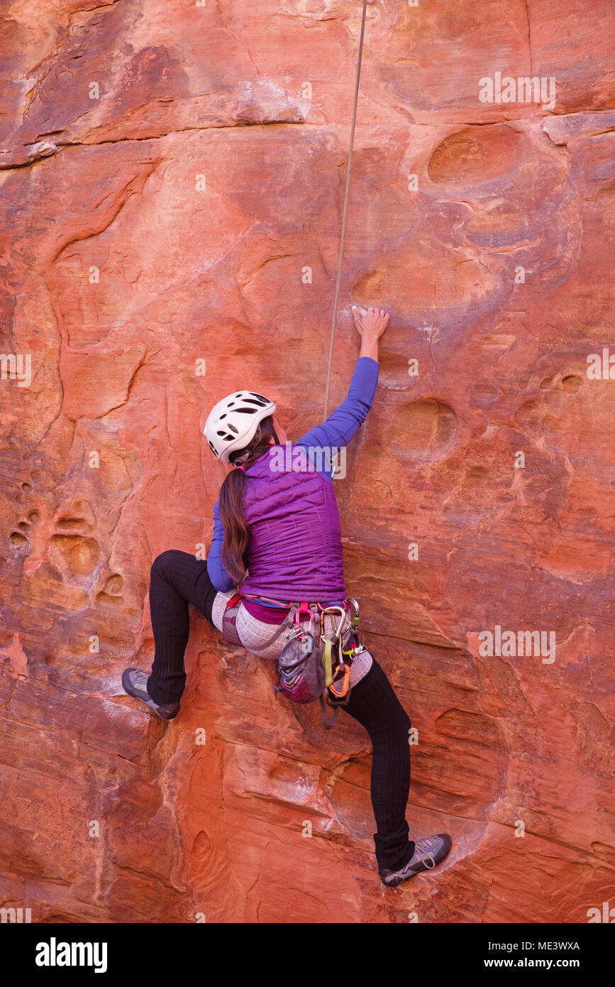 woman rock climbing on steep sandstone cliff Stock Photo - Alamy