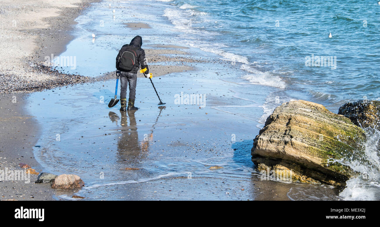 ODESSA, UKRAINE - 01.25.2017. Man with metal detector looking for ...