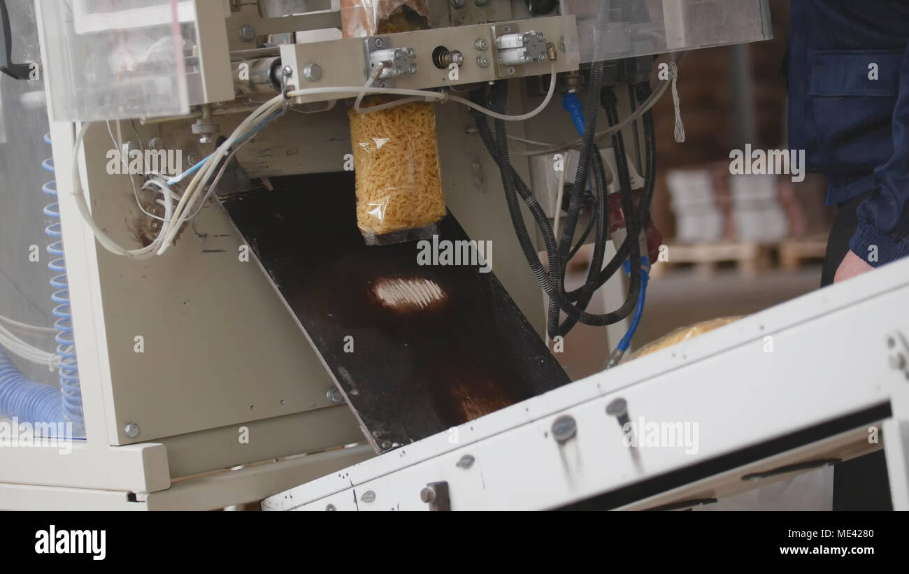 Food manufacturing - packing of macaroni in plastic bags Stock Photo ...