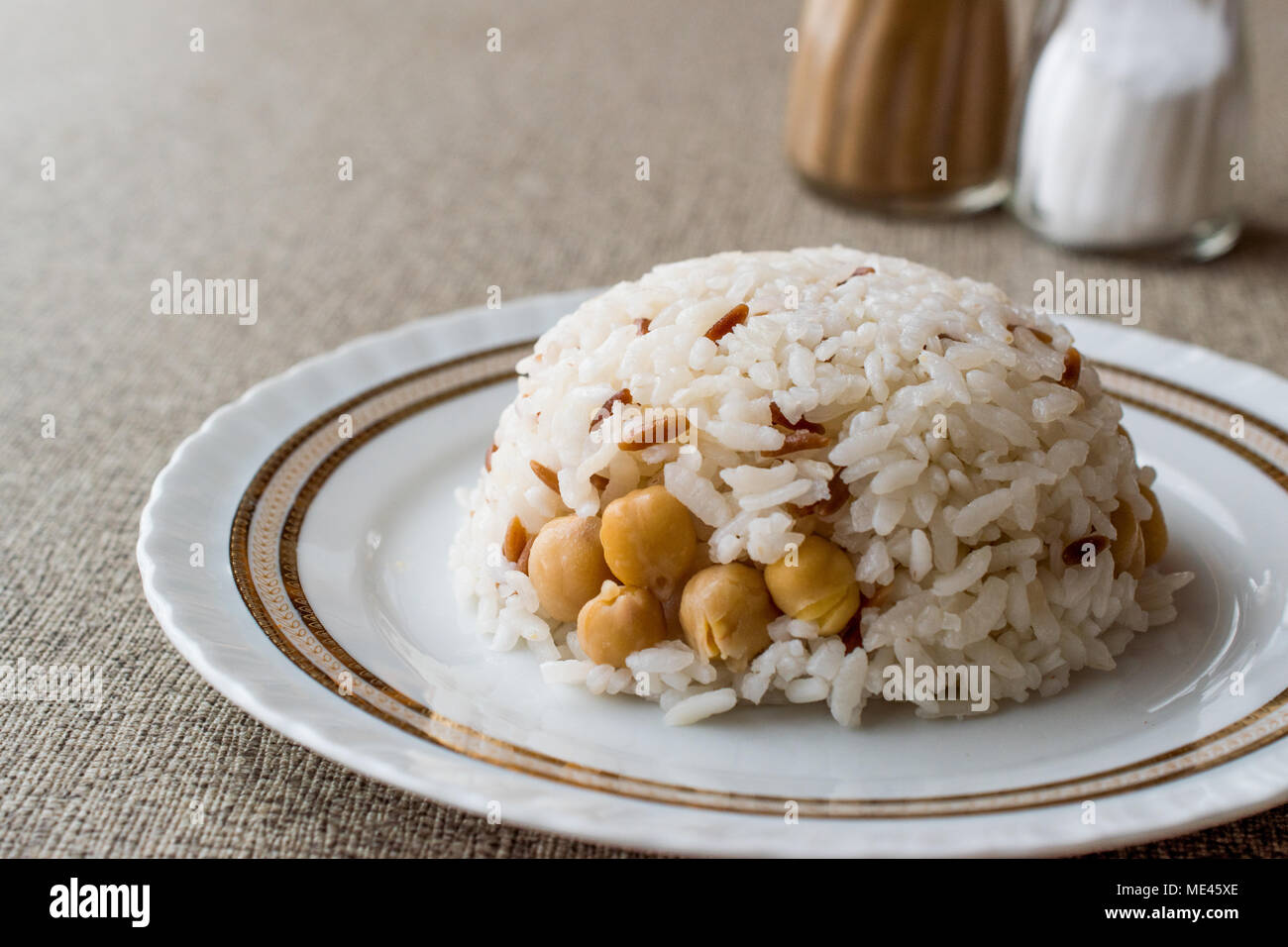 Turkish Rice with chickpea served with salt and pepper / Nohut Pilav ...
