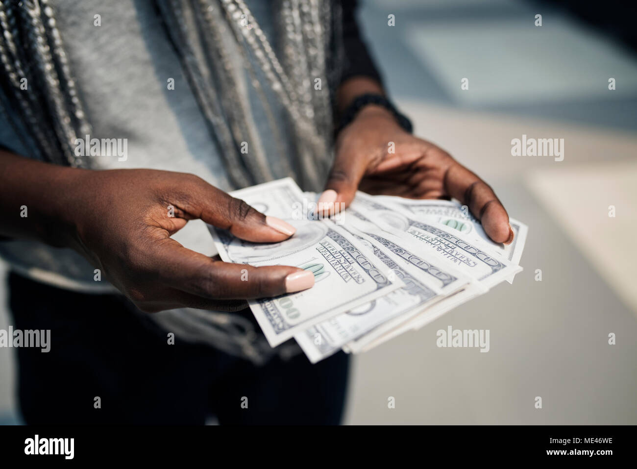 Hands holding a dollar bills Stock Photo - Alamy