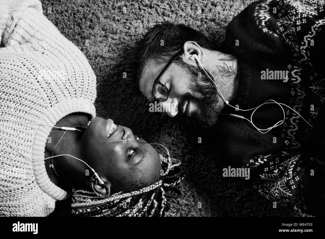 Man listening music smiling Black and White Stock Photos & Images - Alamy