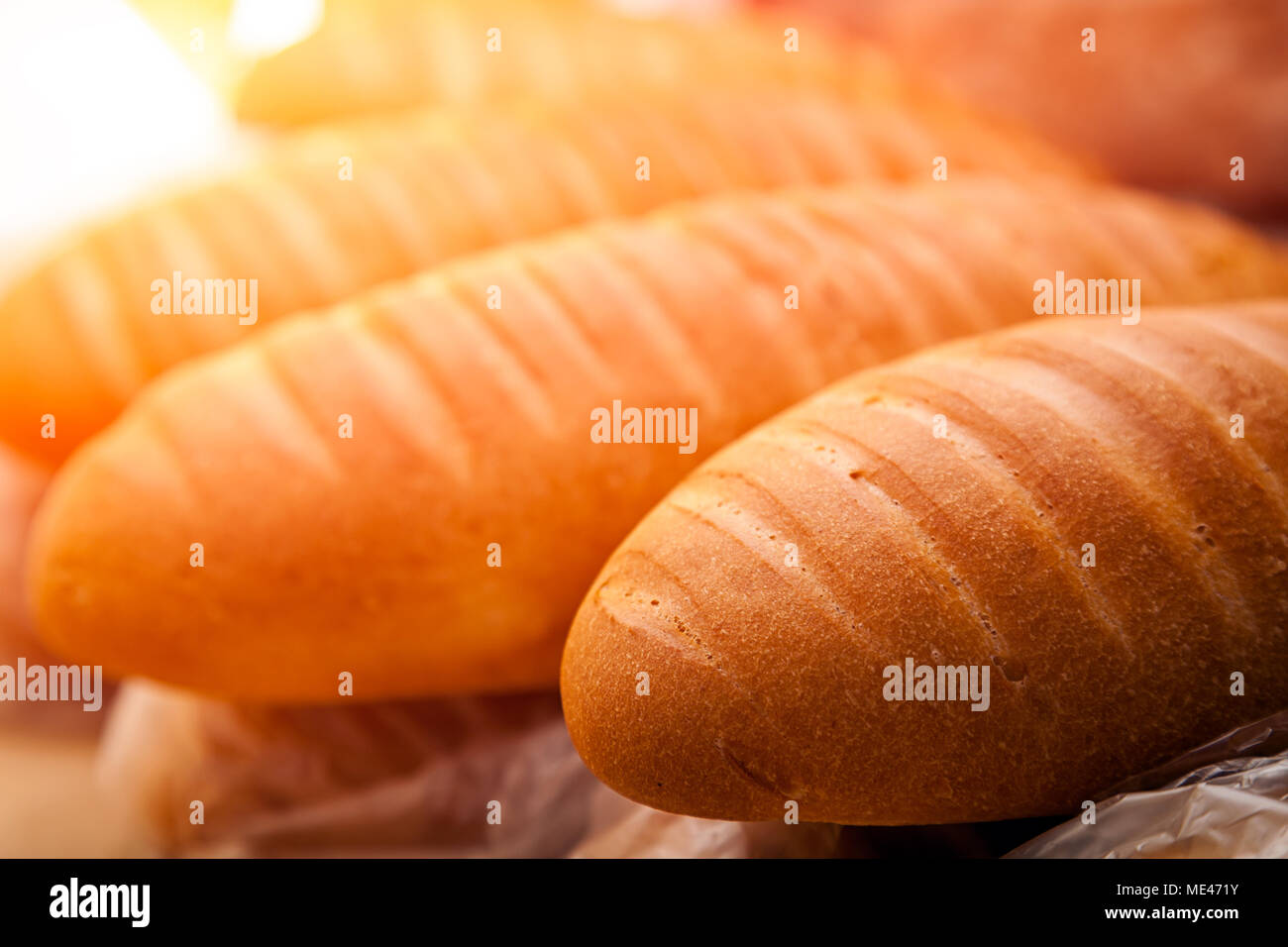Close-up of fresh white bread in buns in a bakery, fresh loaves Stock ...