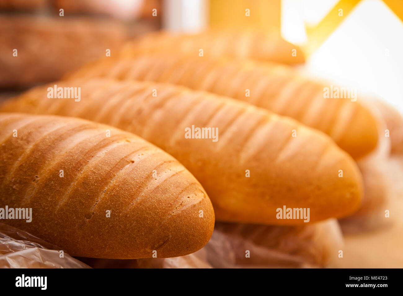 Close-up of fresh white bread in buns in a bakery, fresh loaves Stock ...