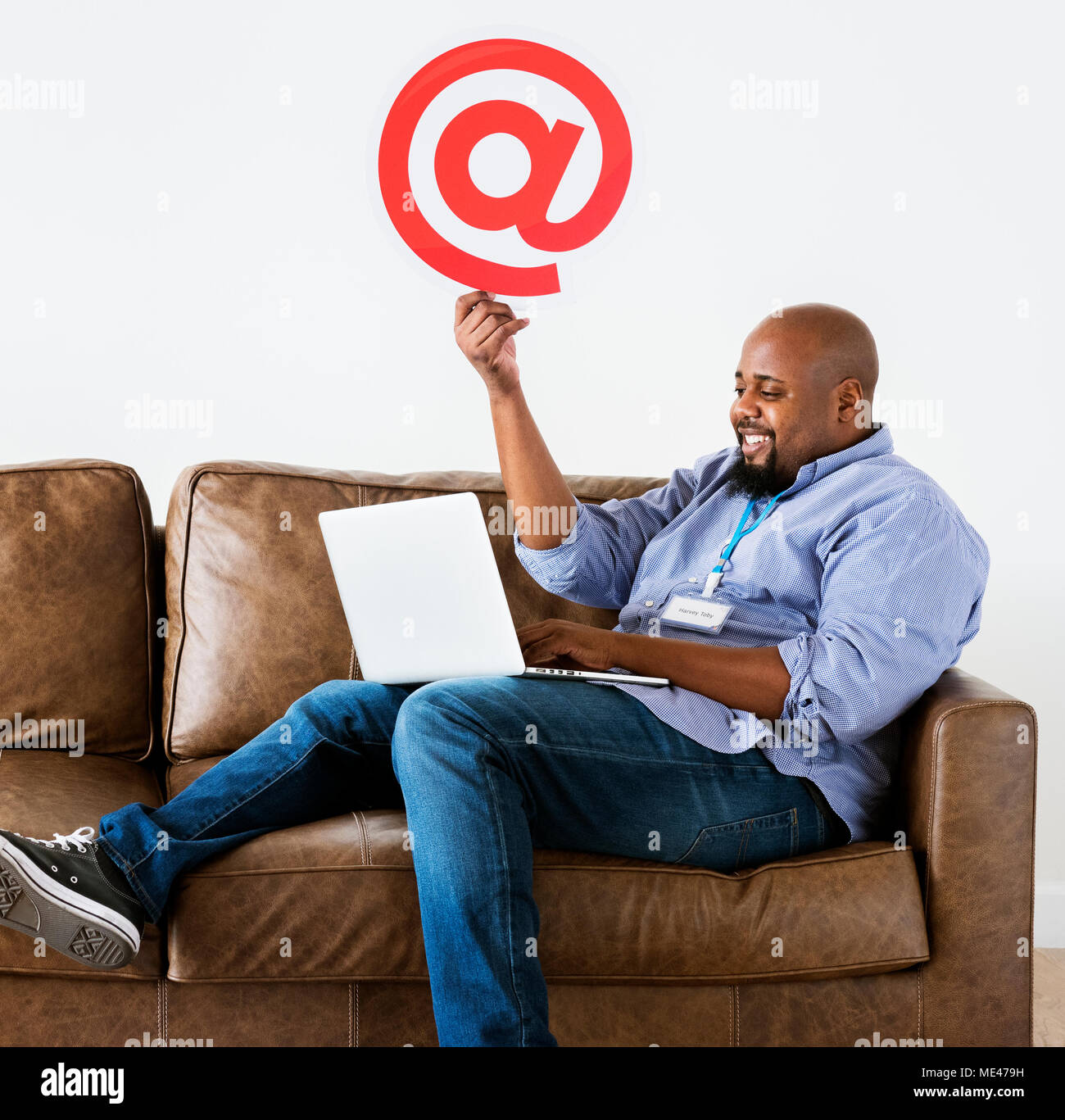 Black man working on laptop Stock Photo - Alamy