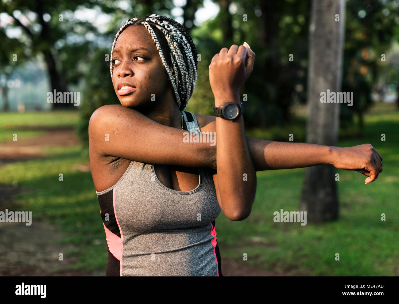 Focused african woman stretching hi-res stock photography and images ...