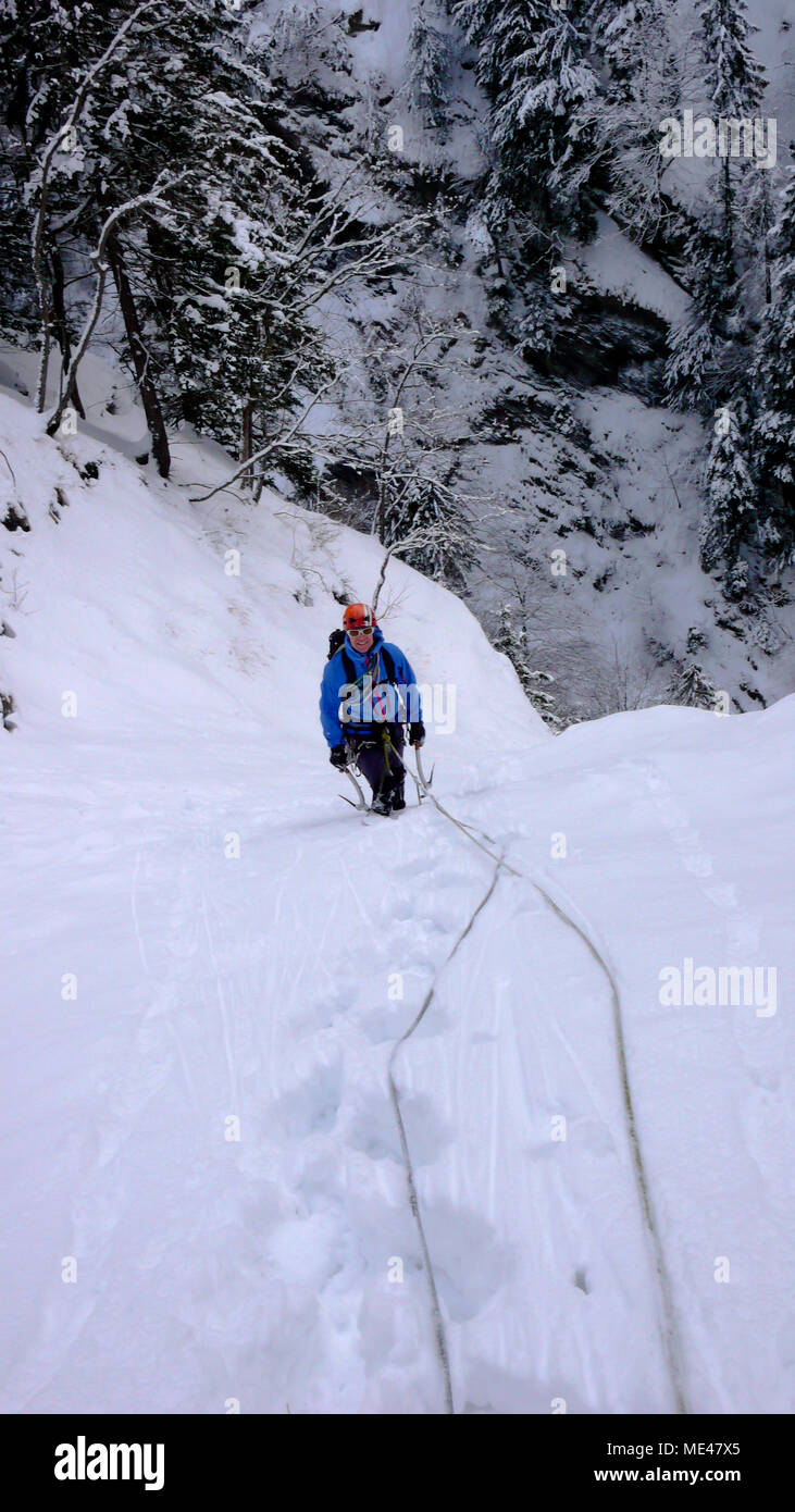 Ice climber at a frozen waterfall hi-res stock photography and images ...