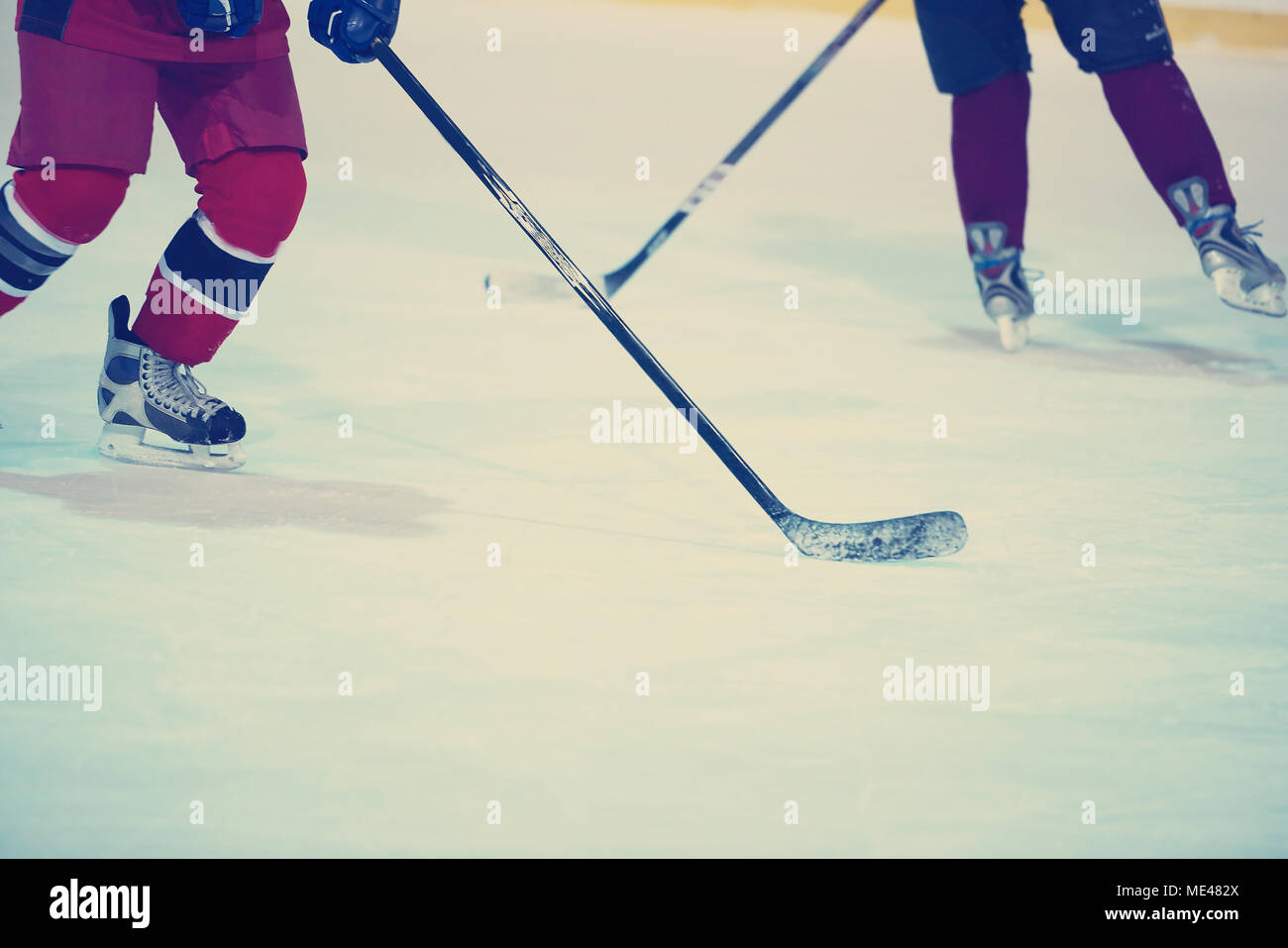 ice hockey player in action kicking with stick Stock Photo - Alamy