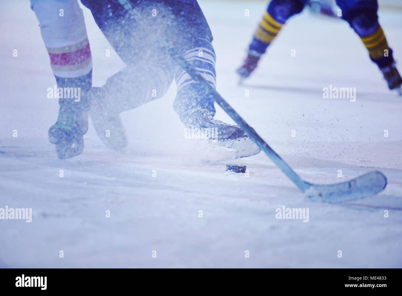 ice hockey player in action kicking with stick Stock Photo - Alamy