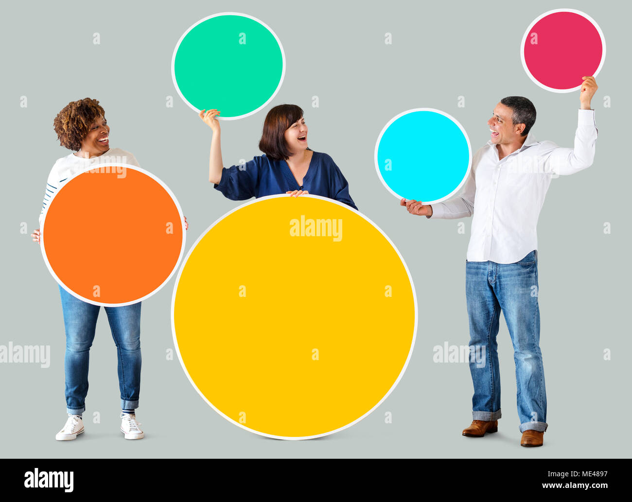 Diverse people holding colorful blank circles Stock Photo - Alamy