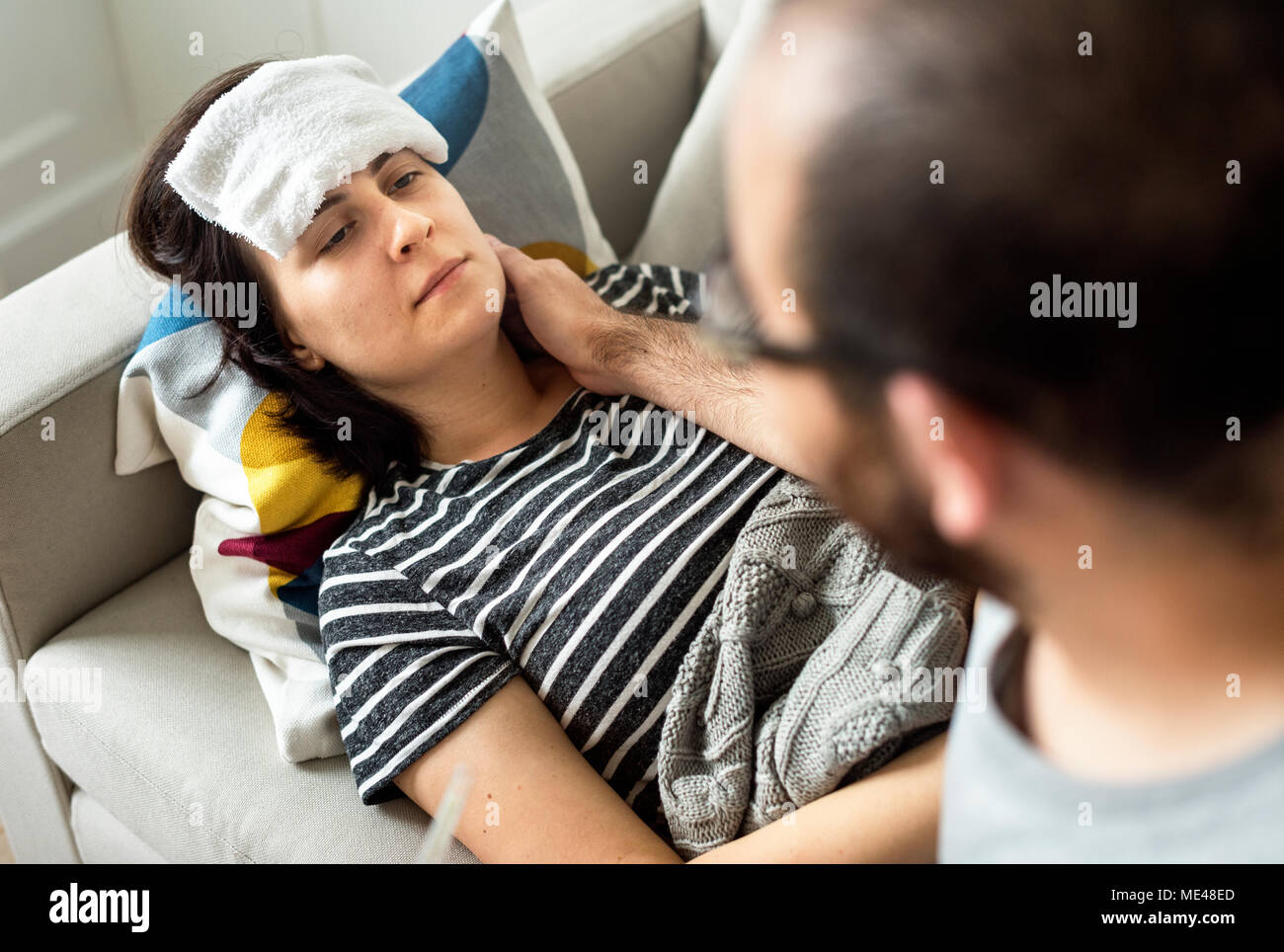Woman with a cold and high fever Stock Photo - Alamy