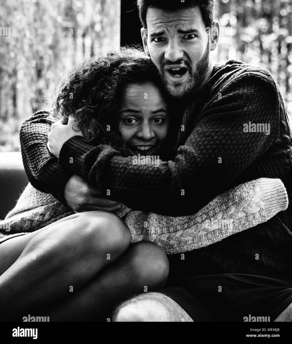 Man watching horror movie hugging hi-res stock photography and images ...