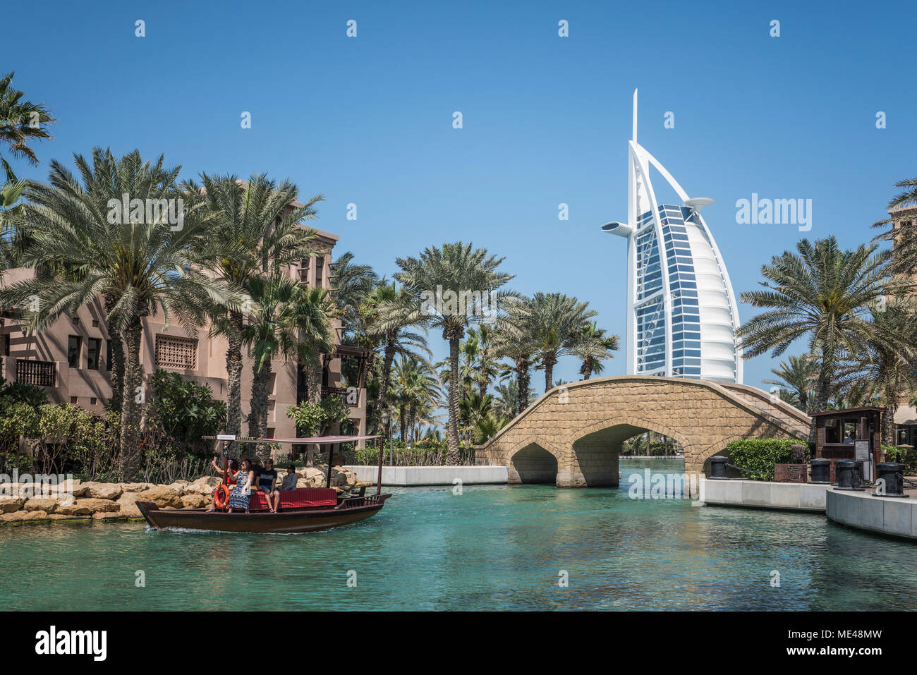The Madinat Jumeirah canal and waterway with the white Burj Al Arab in ...