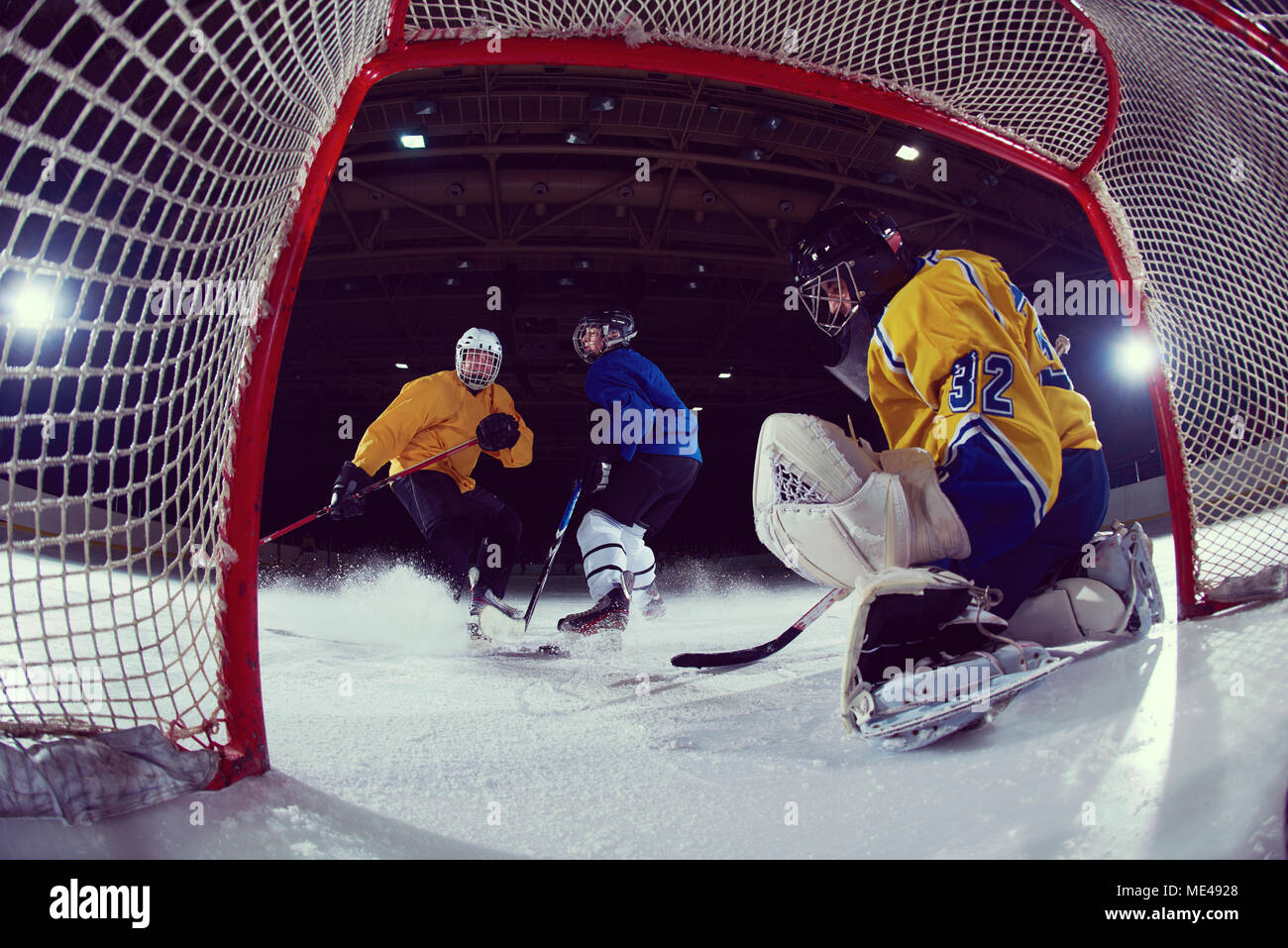 ice hockey goalkeeper player on goal in action Stock Photo - Alamy