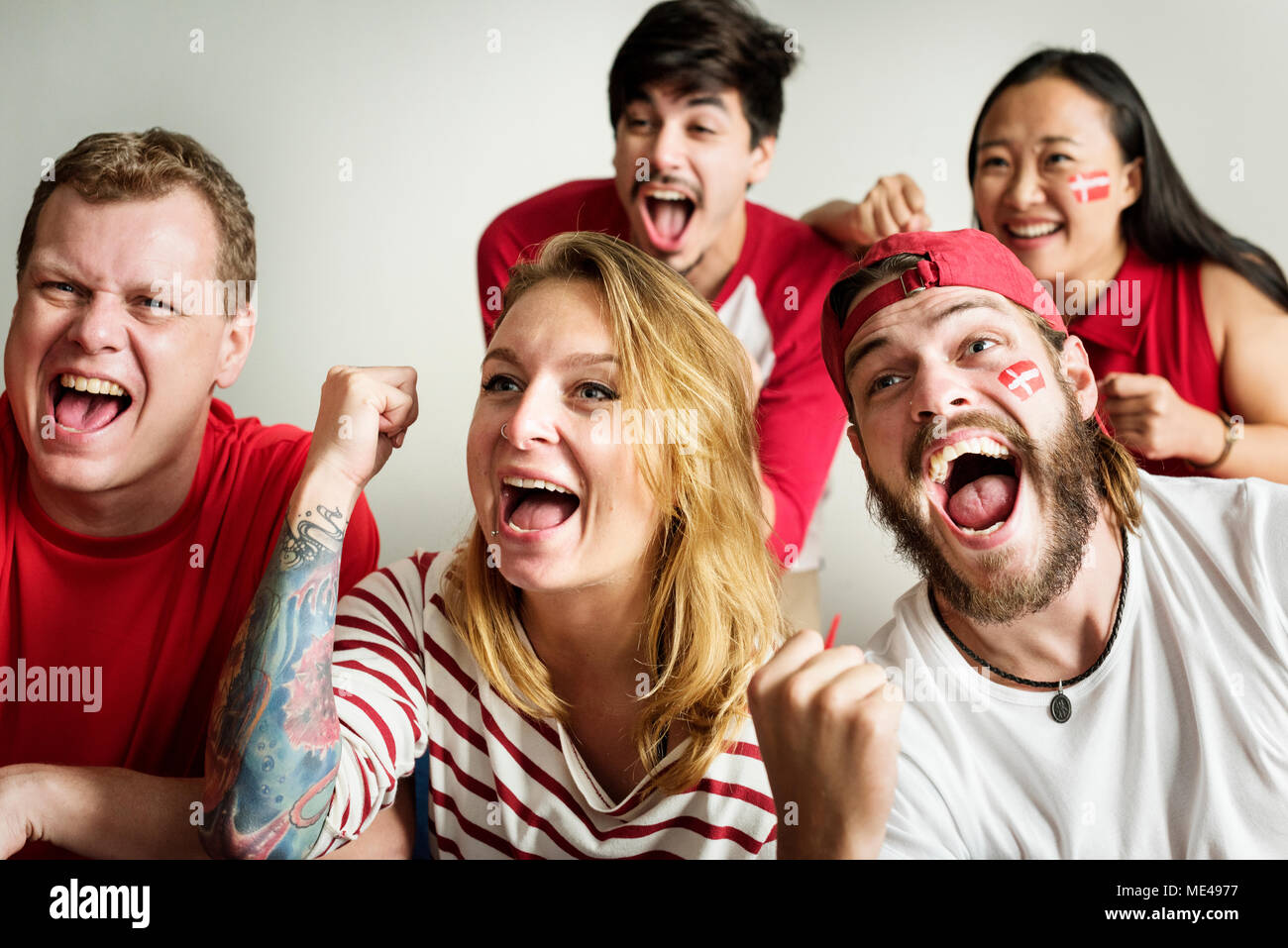 Friends cheering world cup with painted flag Stock Photo - Alamy