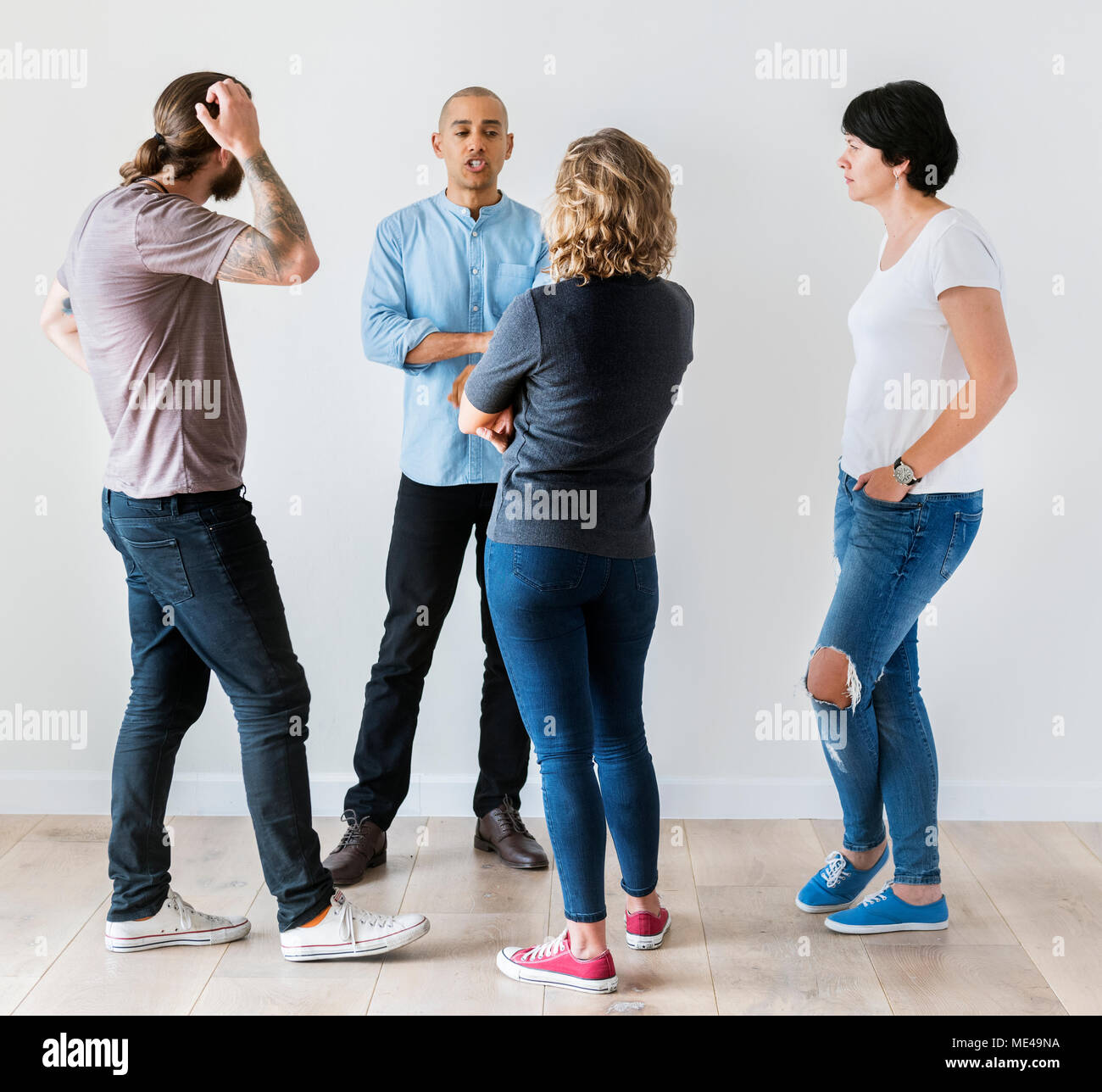 Group of people having a discussion Stock Photo - Alamy