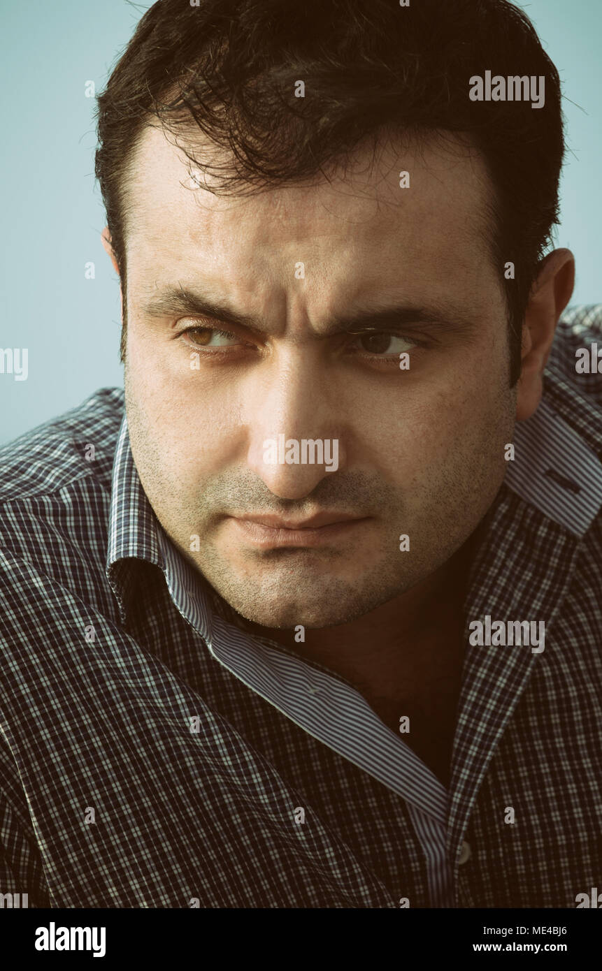 Portrait of a serious pensive Arab man looking away Stock Photo - Alamy