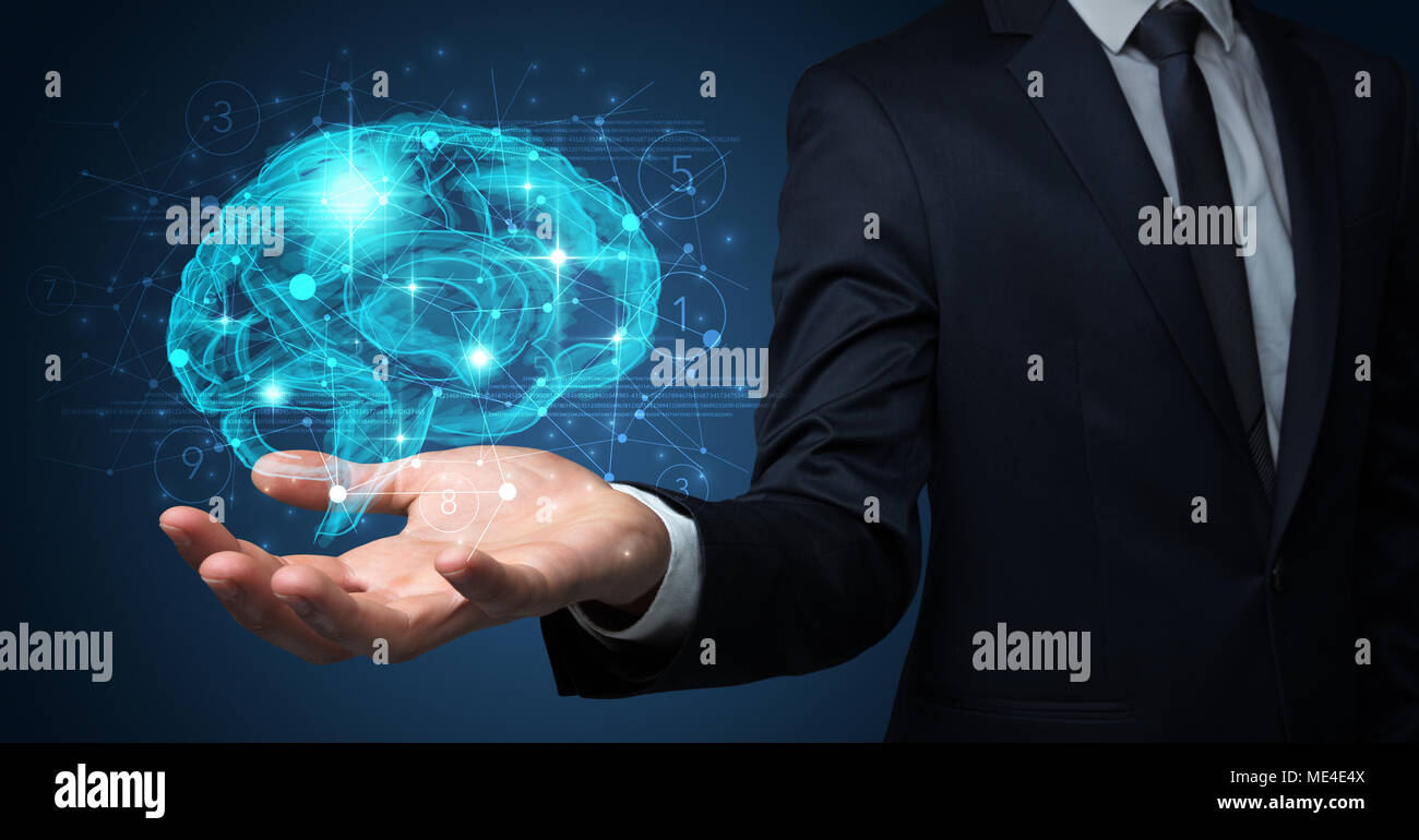 Businessman holding human brain on his hand with logistics symbols ...