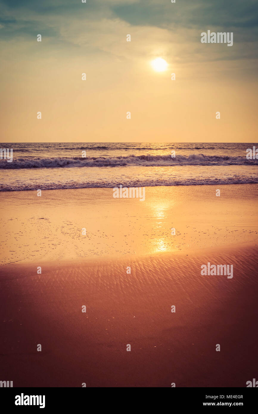 sunset over Beach and tropical sea- India Stock Photo - Alamy
