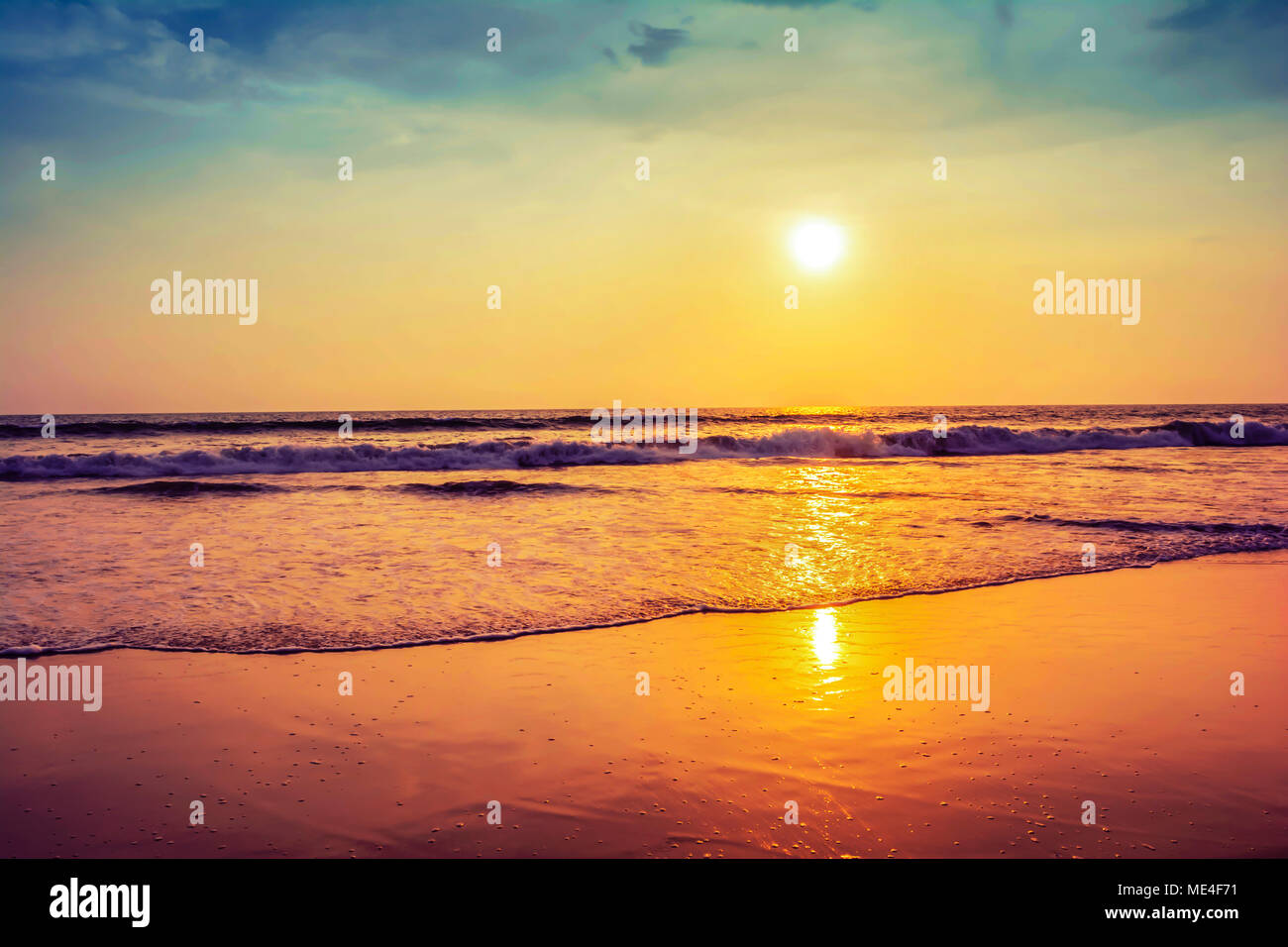 sunset over Beach and tropical sea- India Stock Photo - Alamy