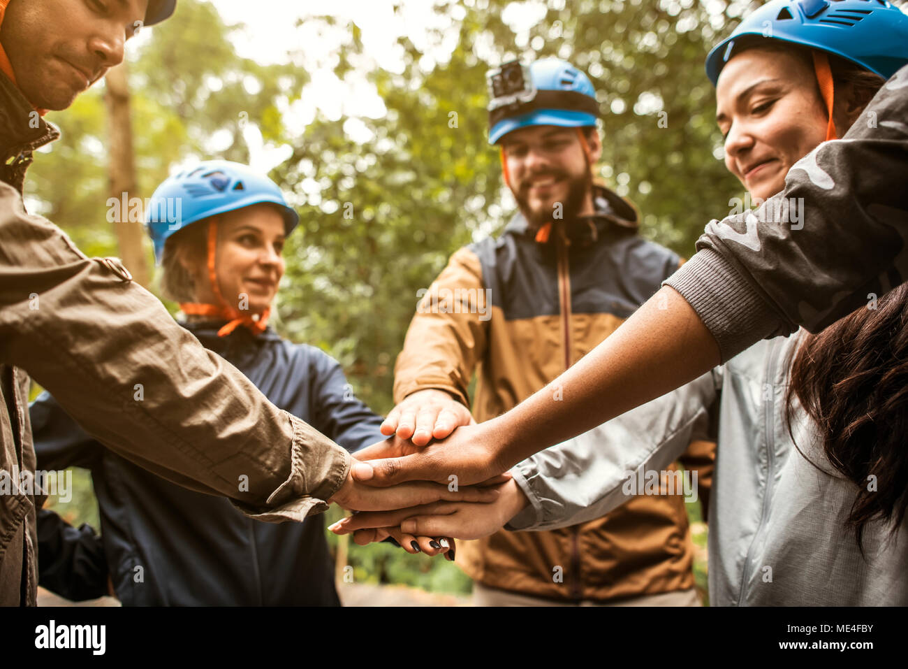 Team building outdoor in the forest Stock Photo - Alamy