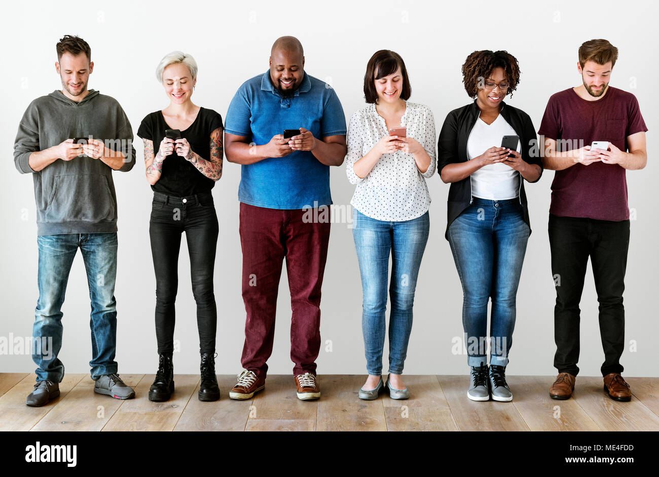 Group of people using mobile phone Stock Photo - Alamy