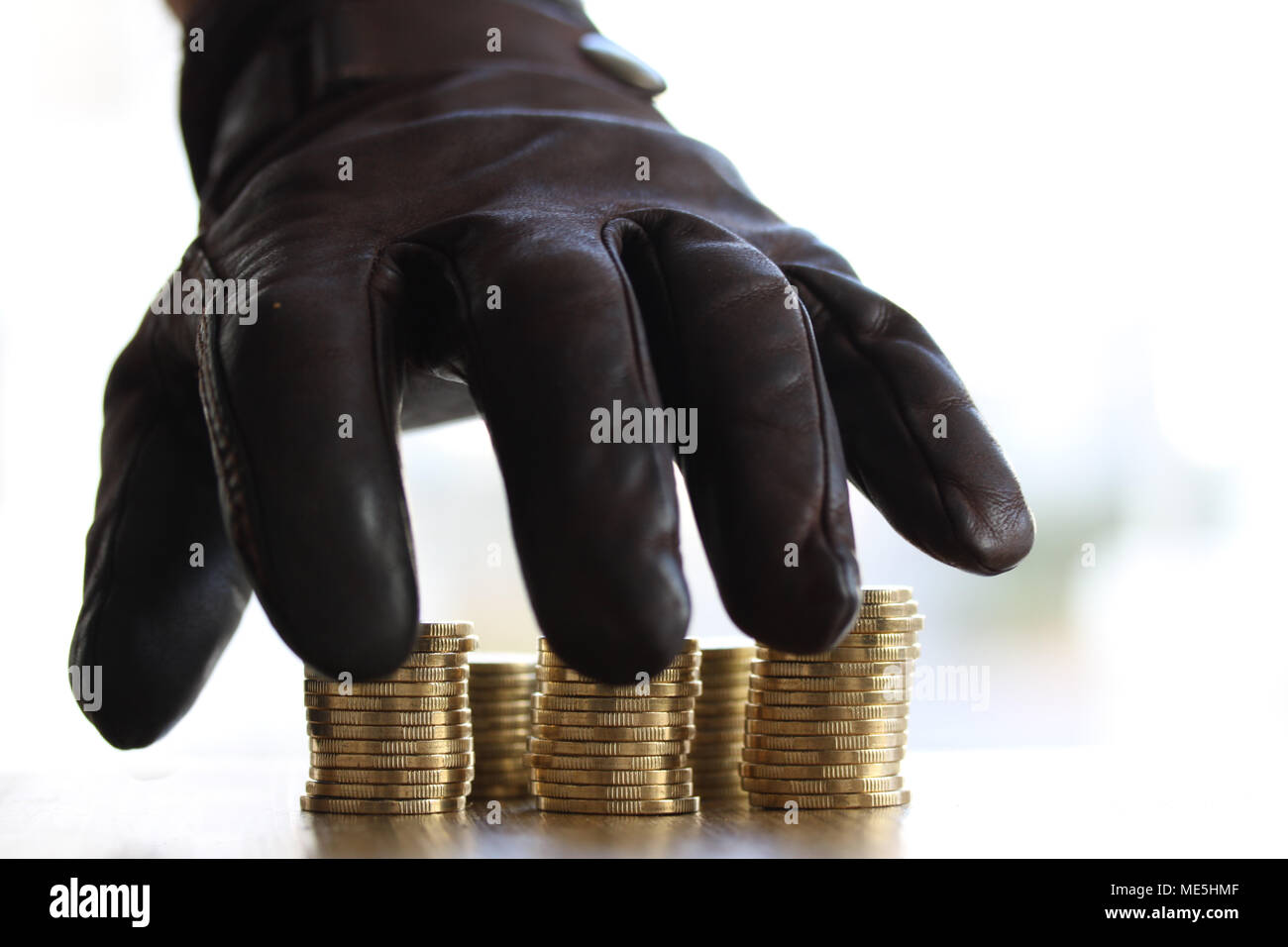 Stealing money - Greedy hand with black gloves grabbing or reaching out ...