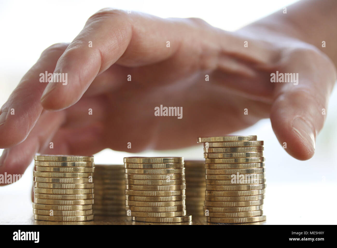 Hand reaching coins hi-res stock photography and images - Alamy
