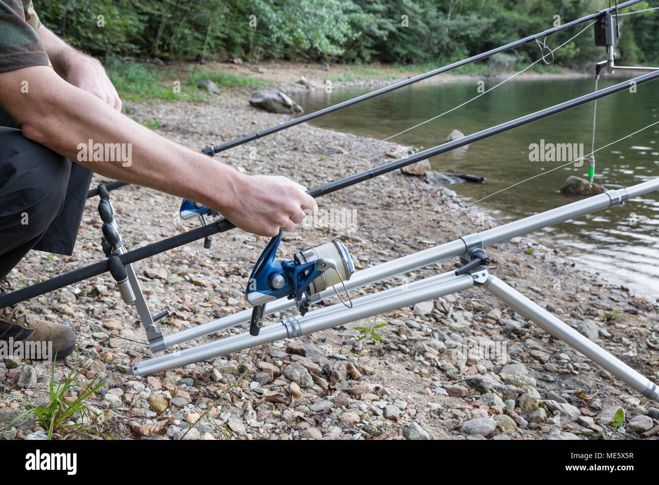 Hand grabbing fish hi-res stock photography and images - Alamy