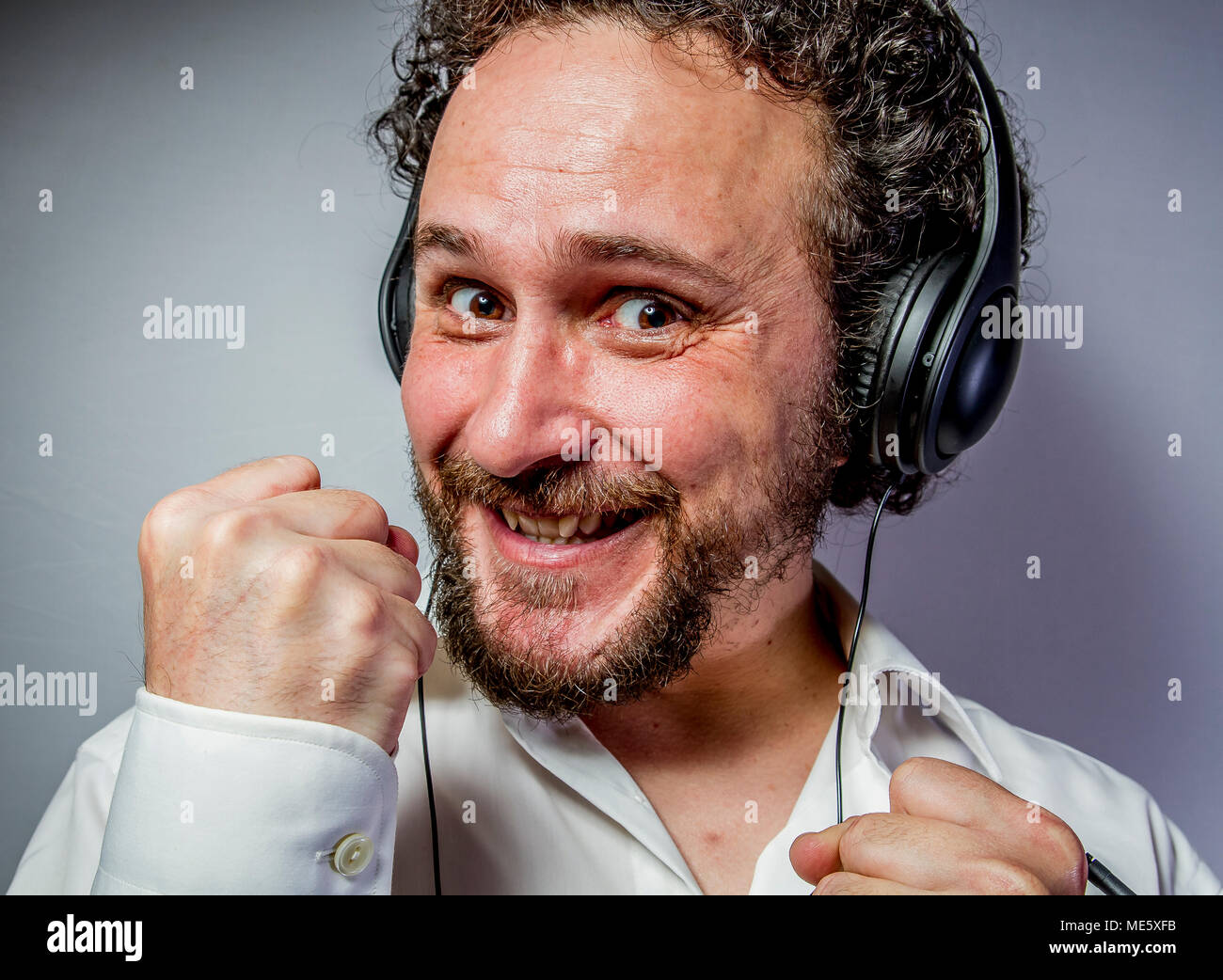 Funny, man with intense expression, white shirt Stock Photo - Alamy