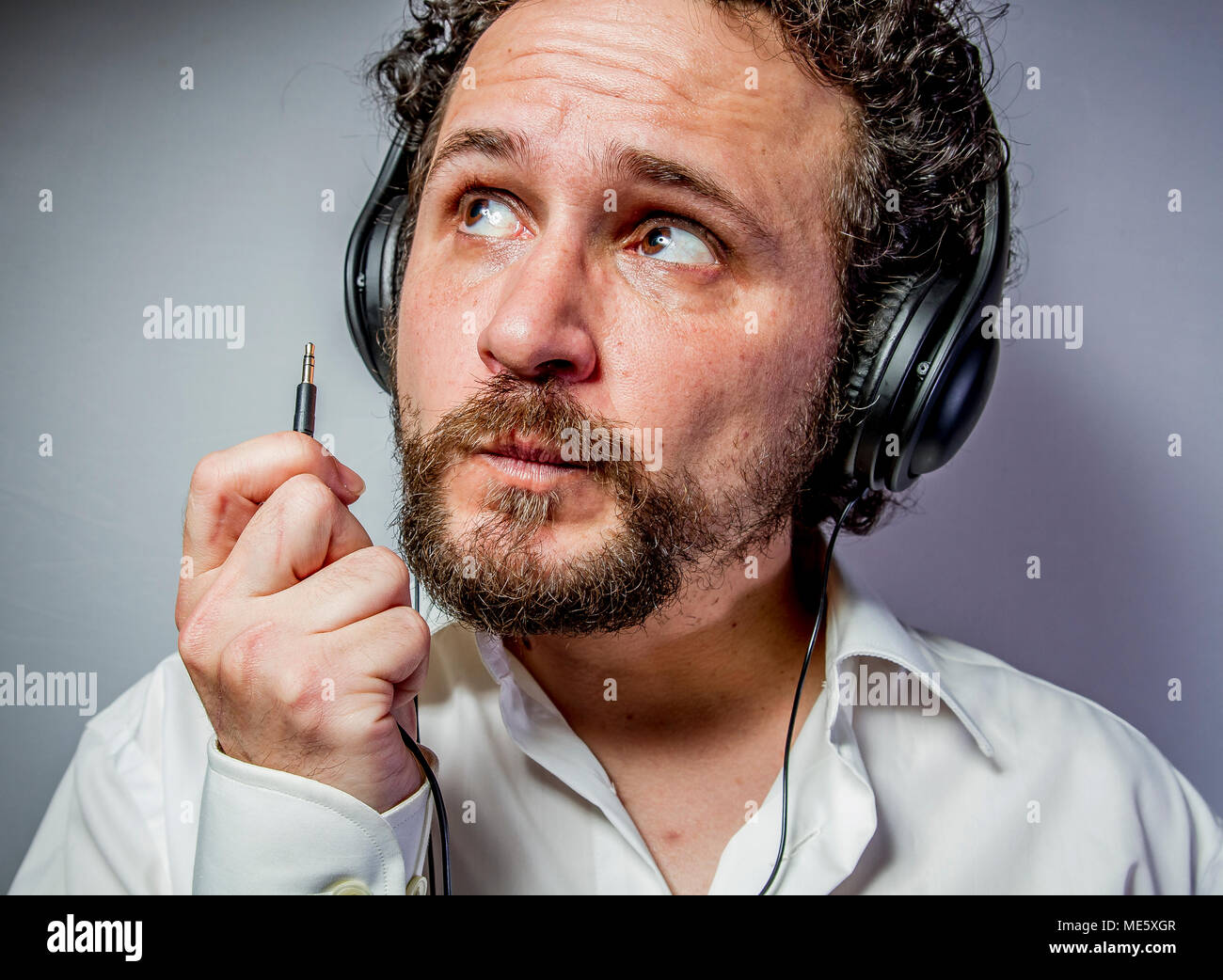 Funny, man with intense expression, white shirt Stock Photo - Alamy