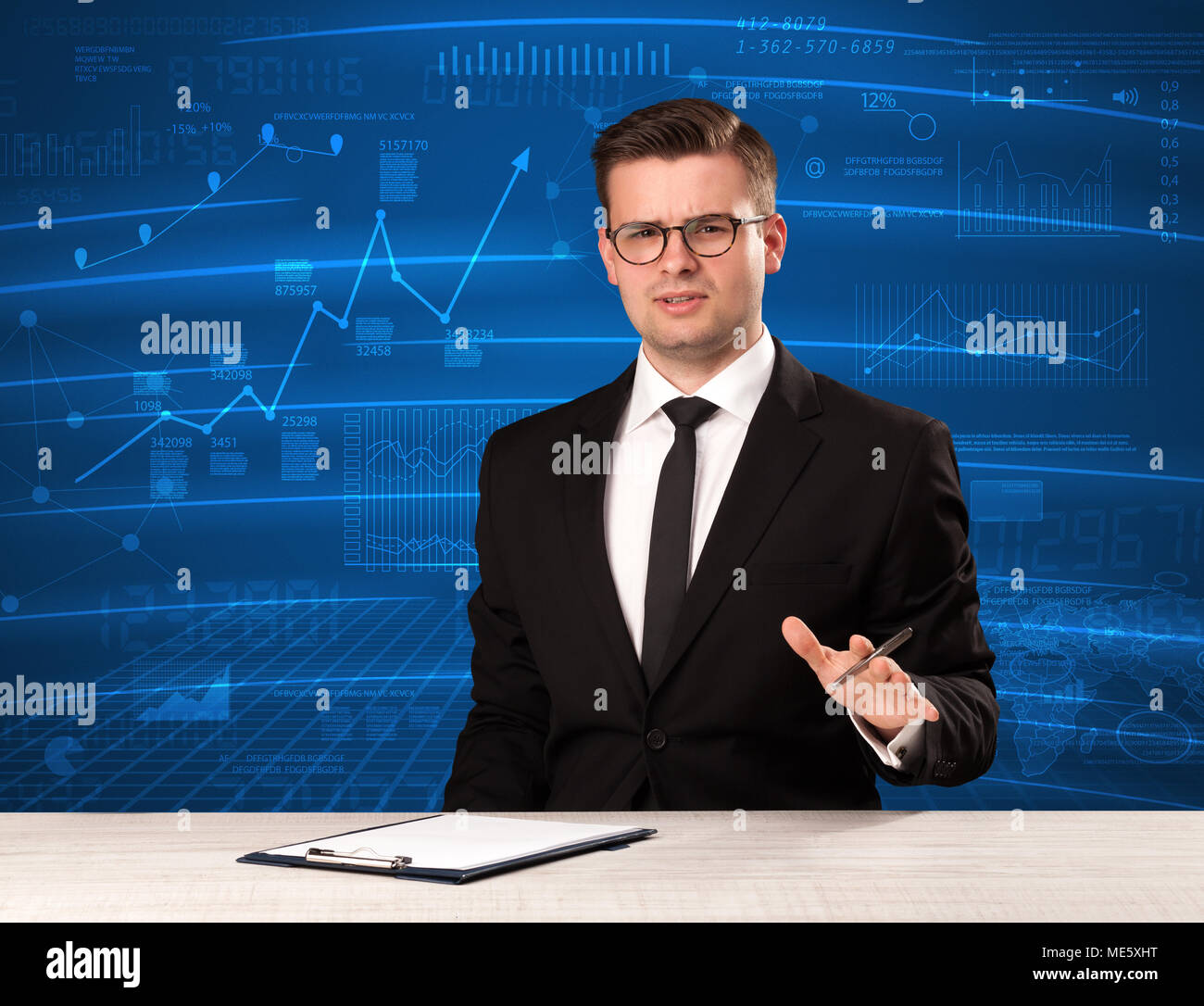 Stock data analyst in studio giving adivce on blue chart background ...