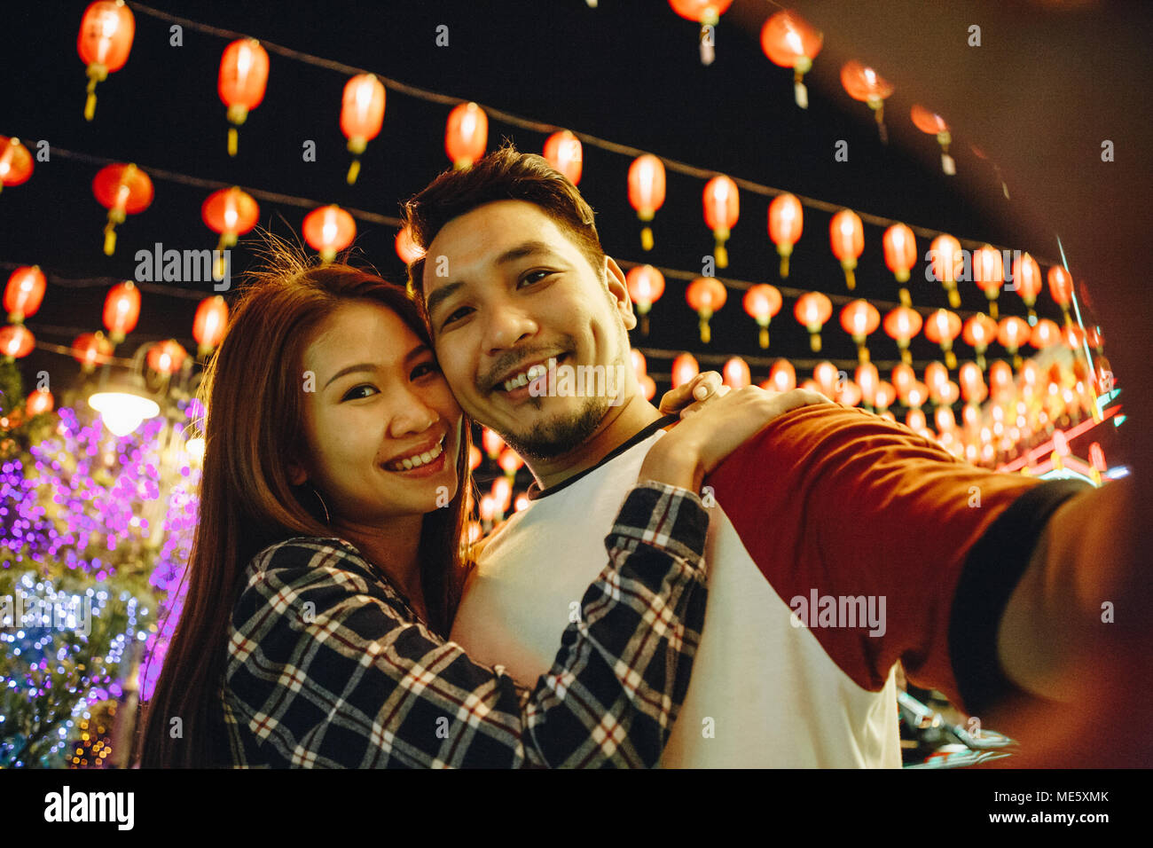 Asian couple at Chinese fastival Stock Photo - Alamy