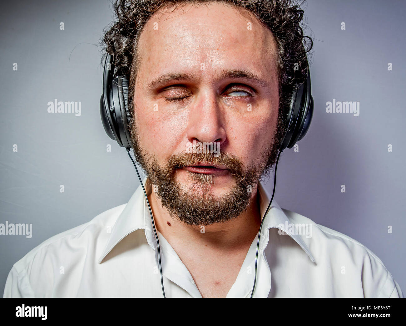 hate music, man with intense expression, white shirt Stock Photo - Alamy