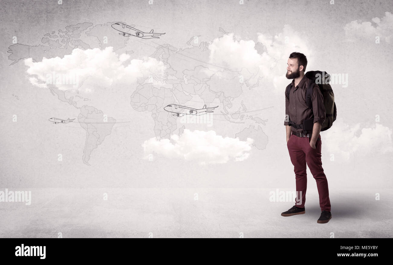 Handsome young man standing with a backpack on his back and planes in ...