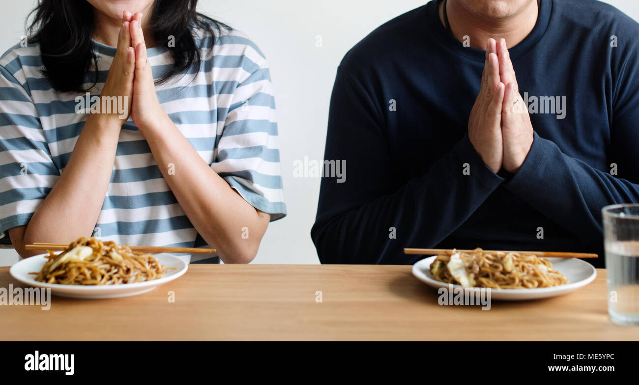 Asian couple about to eat noodles Stock Photo - Alamy